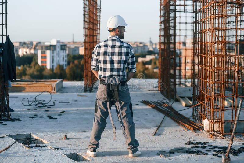 Rear View. Man is Standing on the Construction Site at Daytime Stock ...