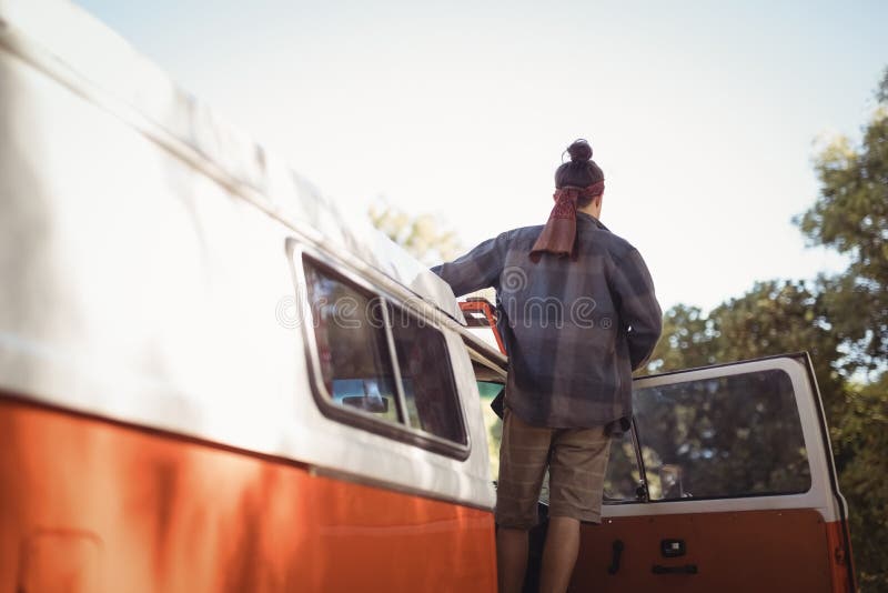 Rear View of Man Standing by Van Stock Image - Image of transparent ...