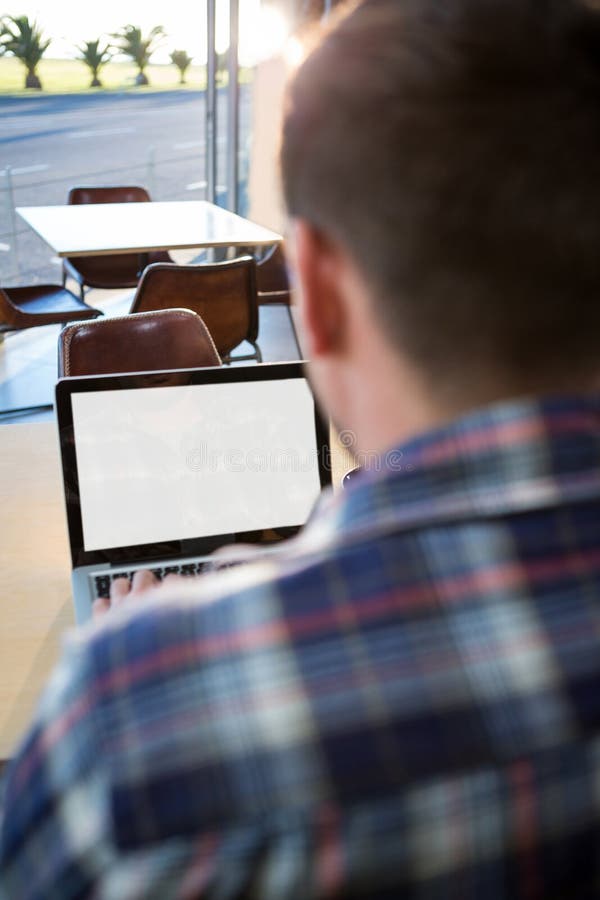 Rear View of Man Using His Laptop Stock Photo - Image of person, coffee ...