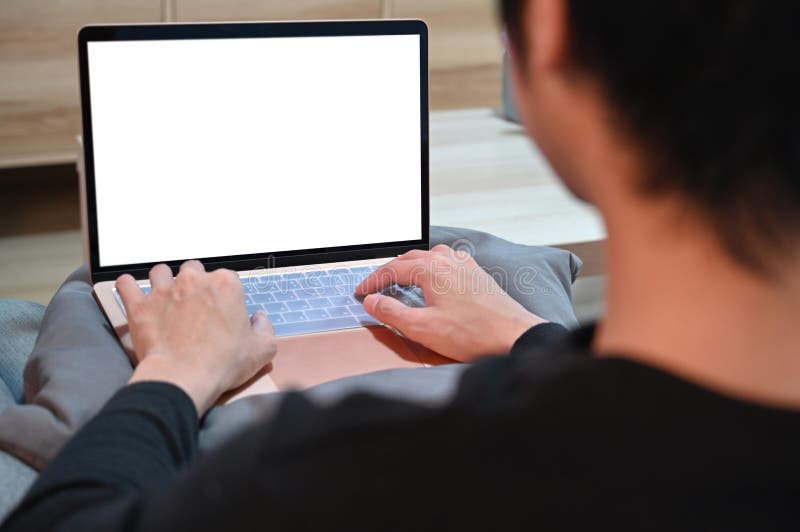 Rear View Man Using Laptop on Sofa. Stock Photo - Image of learning ...