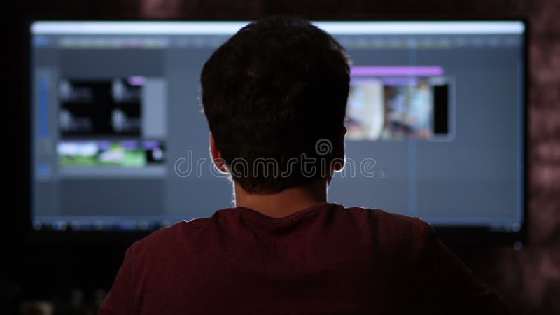 Rear View of Man Working on Wide Screen Computer Stock Video - Video of ...