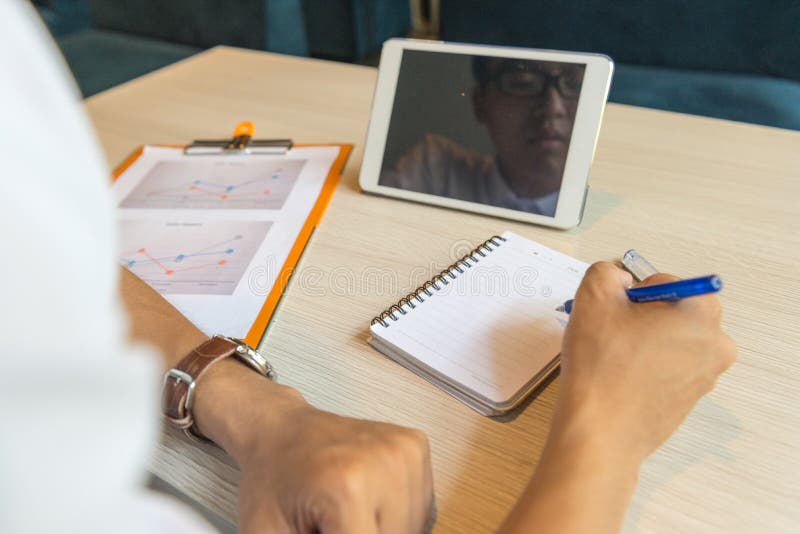 Rear View of Man Writing Notes in the Office Stock Photo - Image of ...