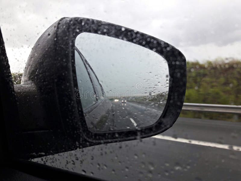 Rear View Mirror Reflecting Road and Cloudy Sky Stock Photo - Image of ...