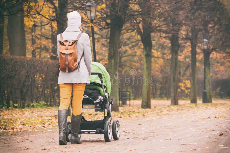 Rear View of Mother Walking with Stroller in Park Stock Photo - Image ...