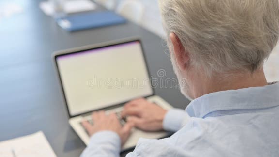 Rear View of Old Man Typing on Laptop Stock Image - Image of office ...