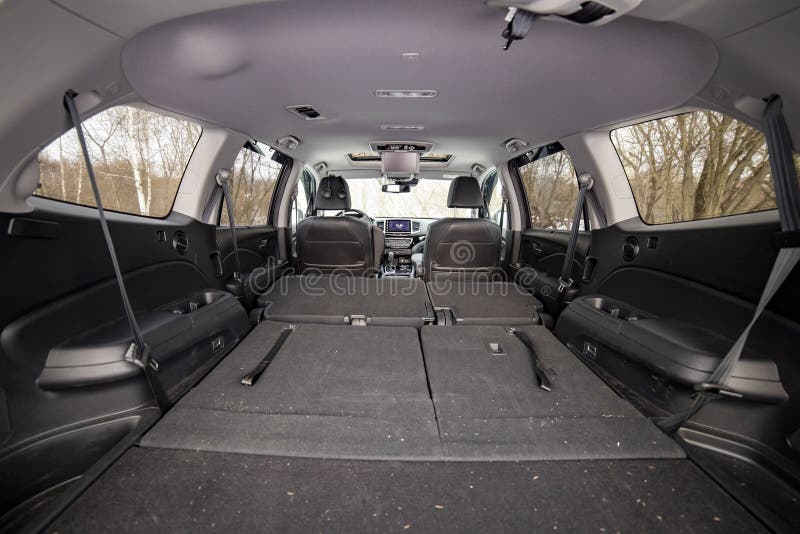 Rear View Open Car Trunk with Folded Passenger Seats. Large Empty Flat ...