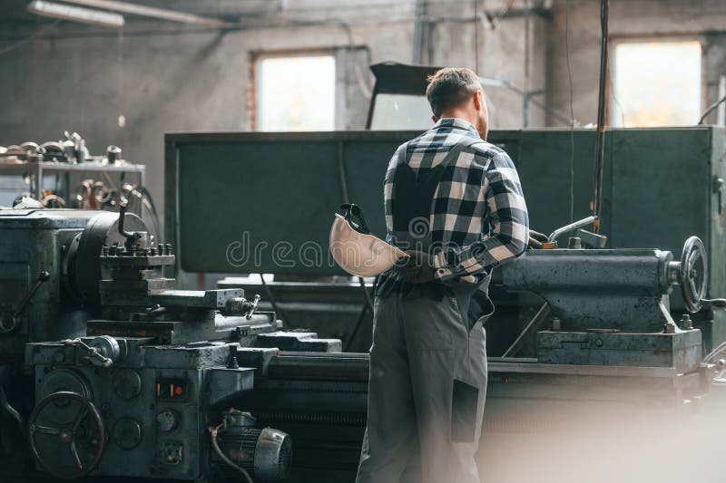 Rear View. Operating Machine Stock Image - Image of hands, operator ...