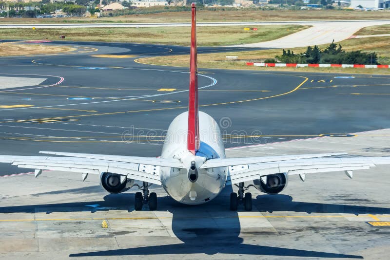 Rear View of a Passenger Plane while Taxiing To Runway Stock Photo ...
