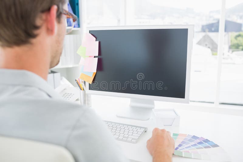 Rear View of Photo Editor Working on Computer Stock Image - Image of ...
