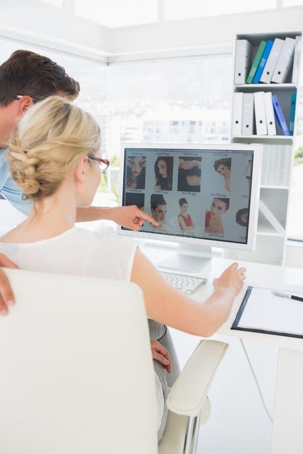 Rear View of Photo Editors Working on Computer Stock Photo - Image of ...