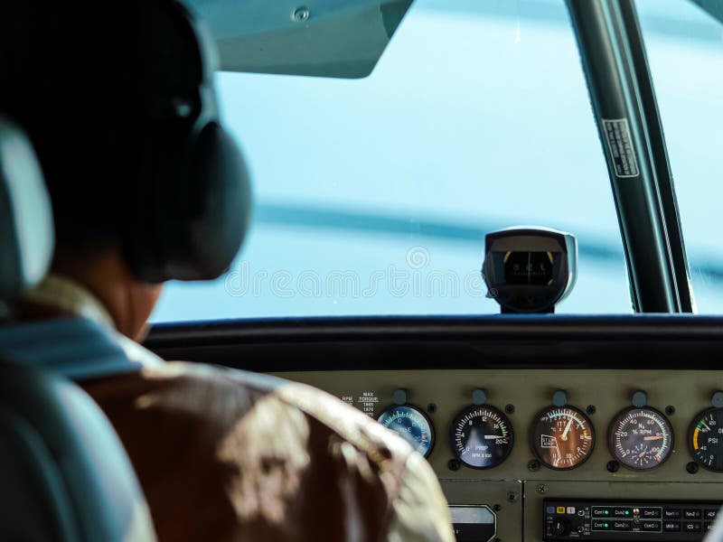 Pilot Operating Controls Inside Airplane Cockpit View Stock Photos ...