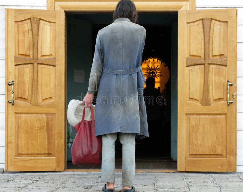 Rear View of a Poor Man Standing in Front of Open Church Doors ...