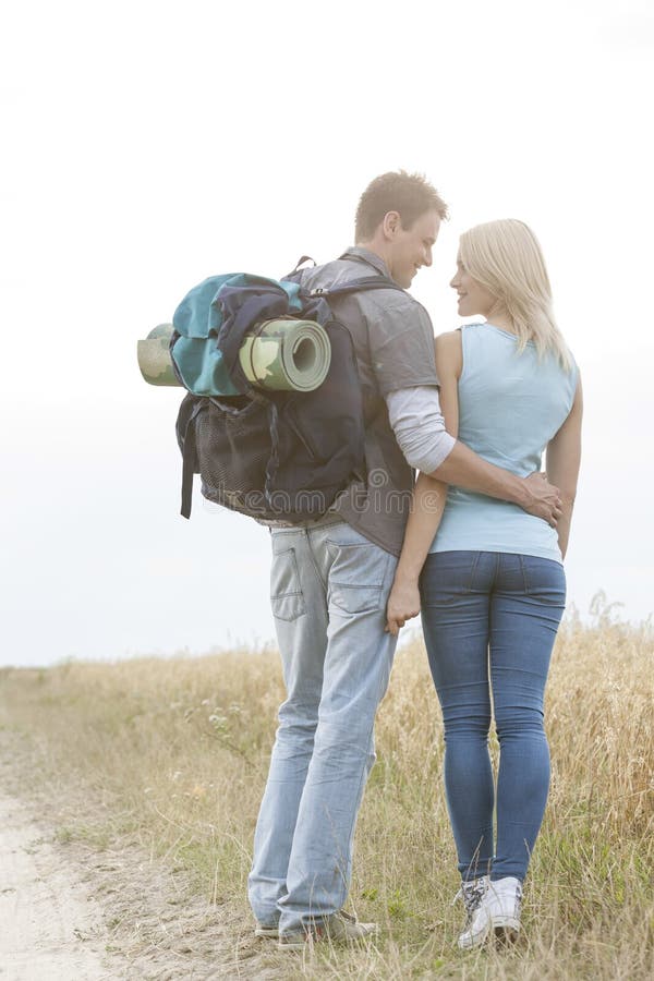 Rear View of Romantic Hiking Couple Looking at Each Other while ...