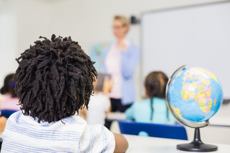 Rear View of School Boy Studying in Classroom Stock Image - Image of ...