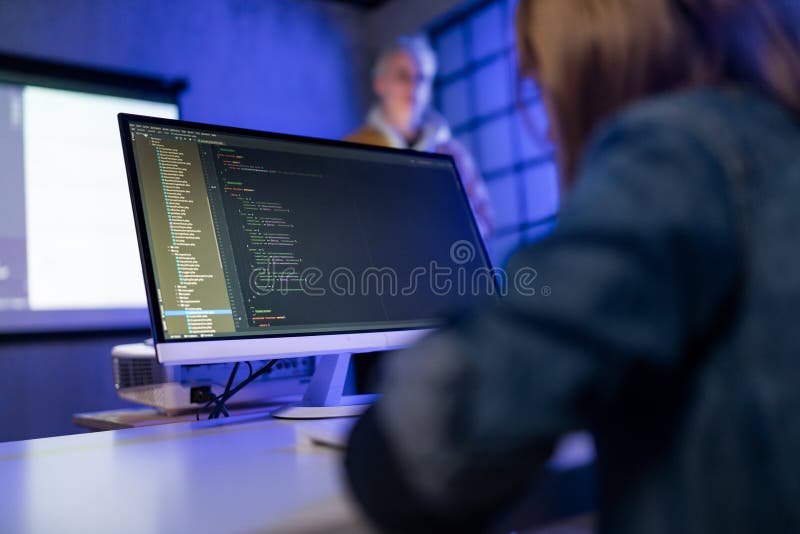 Rear View of Schoolgirl Using Computer in Classroom at School Stock ...