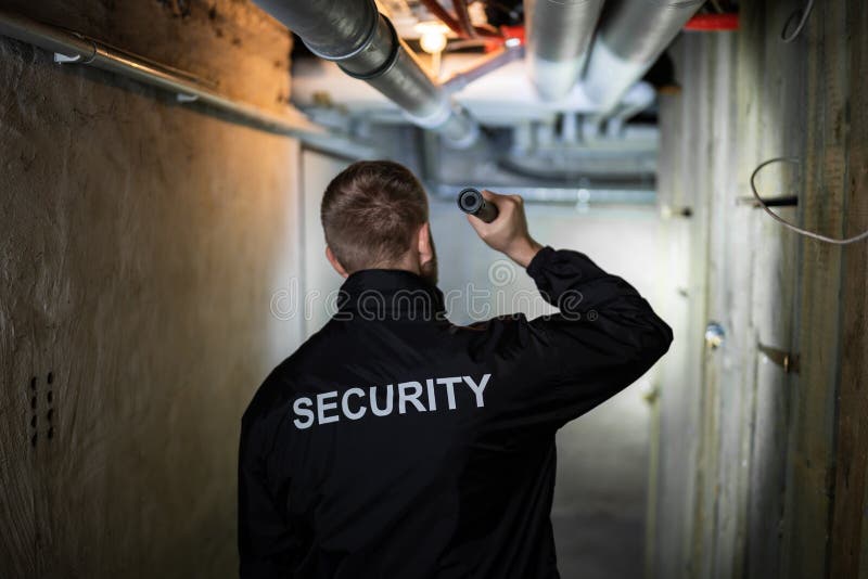 Security Guard Standing in the Basement Stock Photo - Image of security ...