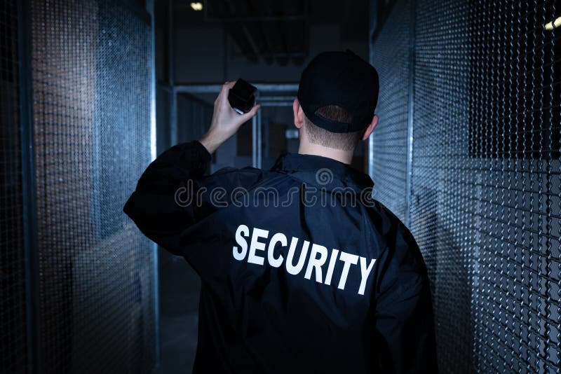 Security Guard Standing in the Warehouse Stock Image - Image of jacket ...