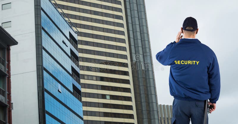 Rear View of Security Guard Talking on Bluetooth Device while Standing ...