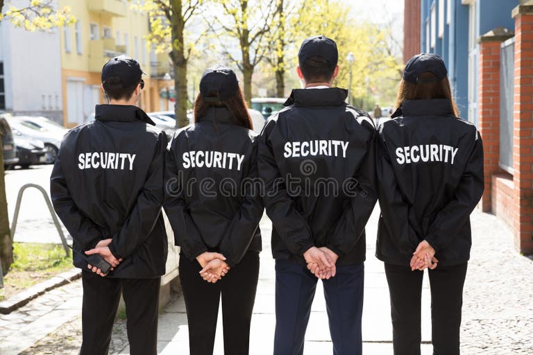 Rear View of Security Guards Standing in a Row Stock Image - Image of ...