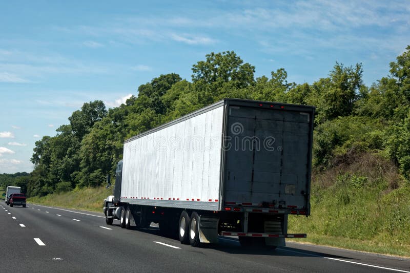 Rear View of Semi Truck on Highway Stock Photo - Image of cargo ...