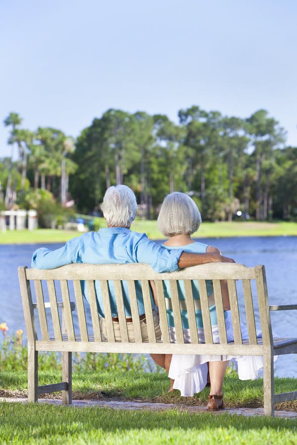Rear View Senior Couple Sitting on Park Bench Stock Image - Image of ...