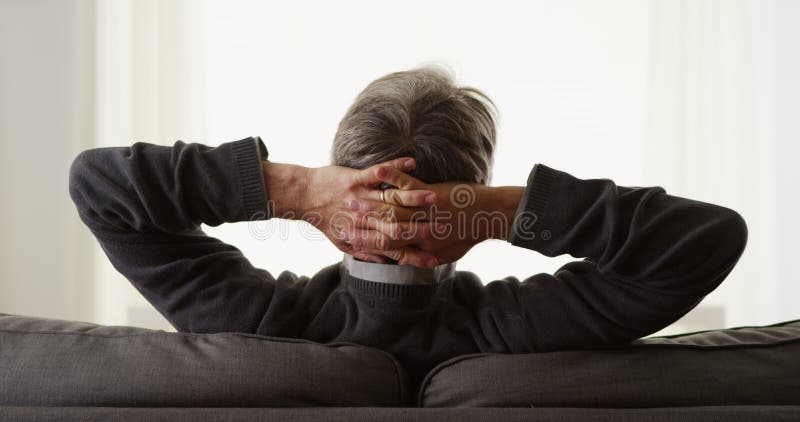Rear View of Senior Lying Back Resting Hands on Head Stock Footage ...
