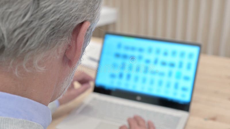 Rear View of Senior Old Man Working on Laptop, Scrolling Stock Image ...