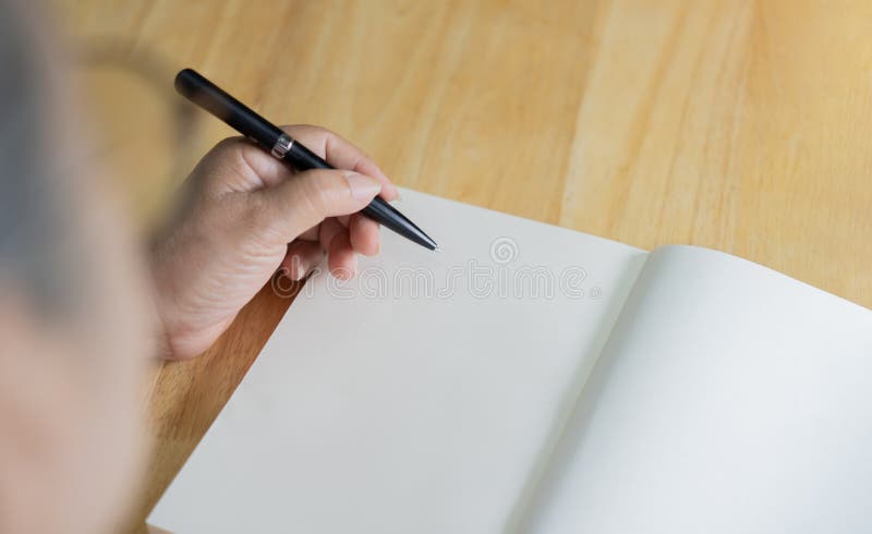 Rear View of Senior Woman Planning Idea on Notebook Using a Pen To ...