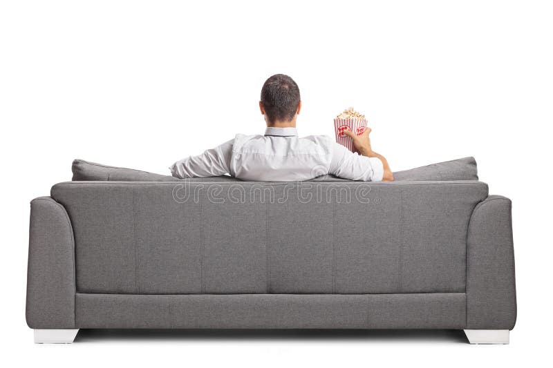 Rear View Shot of a Man Sitting on a Sofa and Eating Popcorn Stock ...