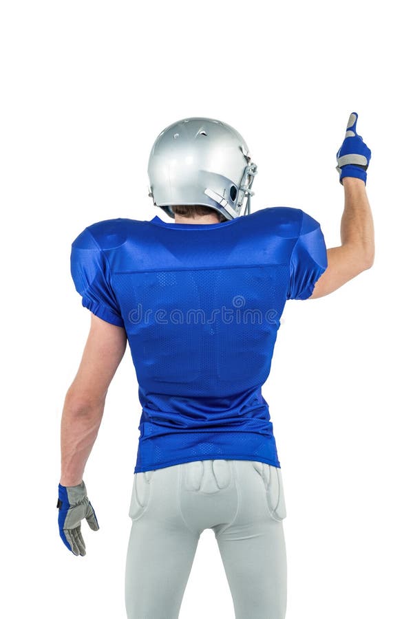 Full Length Rear View of American Football Player Reaching Towards Ball ...