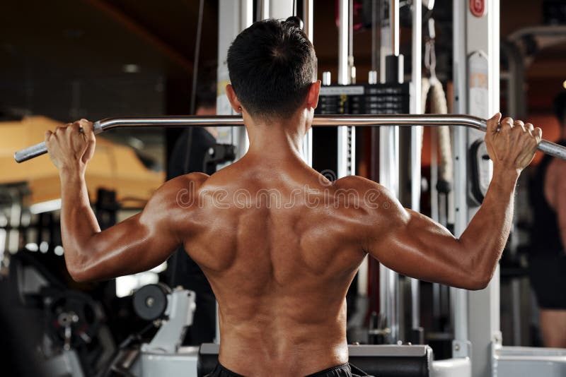 Man Working on Back Muscles Stock Image - Image of strength, macho ...