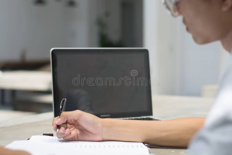 Doing Homework with Laptop and Writing in Notebook Stock Image - Image ...