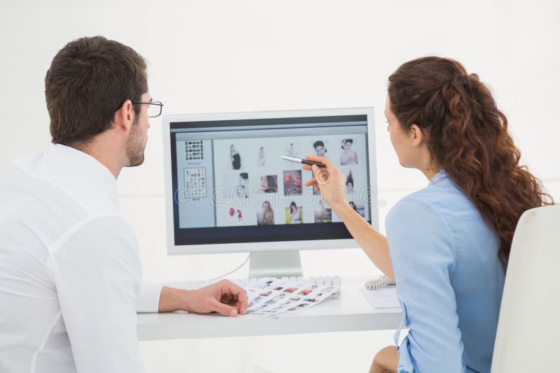 Rear View of Teamwork Using Computer Stock Photo - Image of caucasian ...