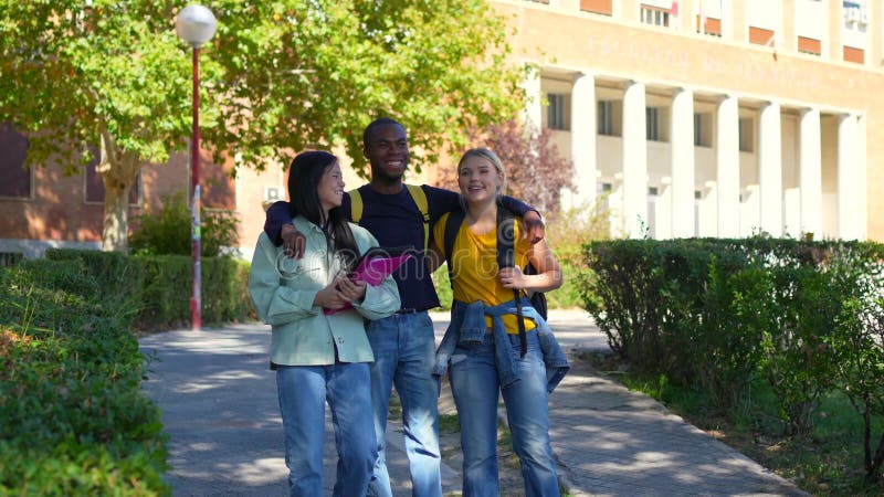 Rear View of Three Students Walking To the University Stock Video ...