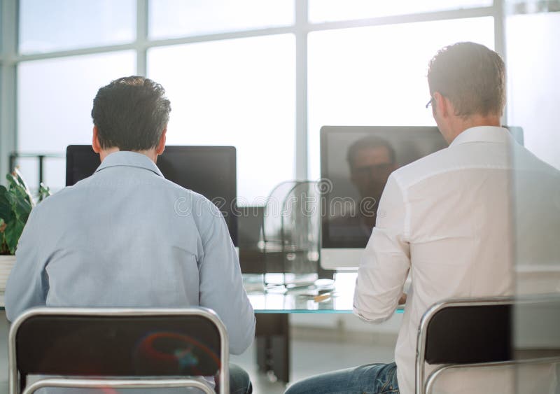 Rear View.two Business People Working at the Desk Stock Photo - Image ...