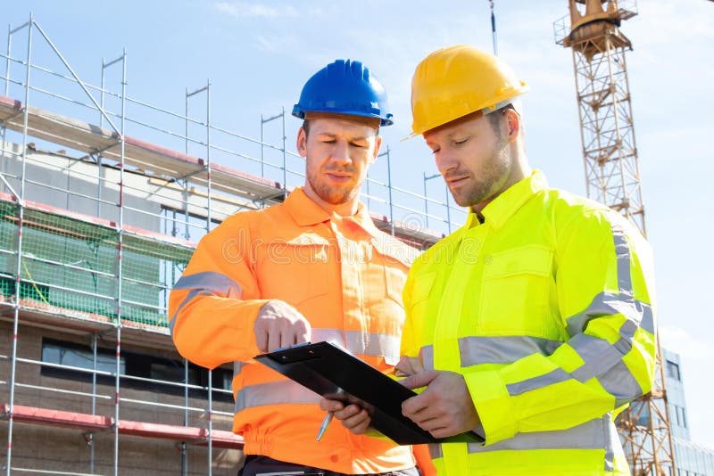 Two Male Engineers Supervising the Construction Site Stock Image ...