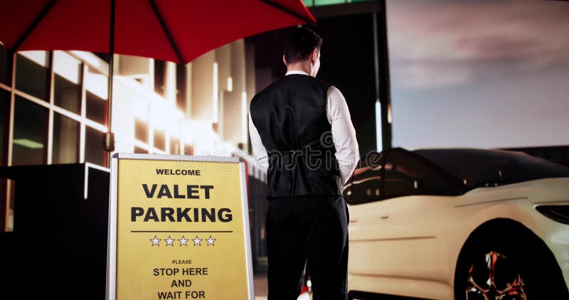 Rear View of a Valet Standing in Front Stock Image - Image of young ...