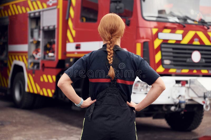 Rear View. Woman Firefighter in Uniform is at Work in Department Stock ...