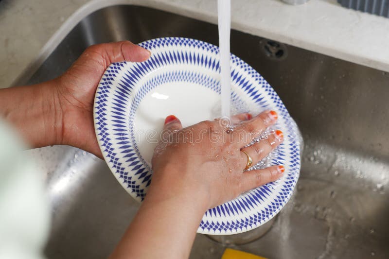 Rear View of Woman Hand Washing a a Plate Stock Photo - Image of ...