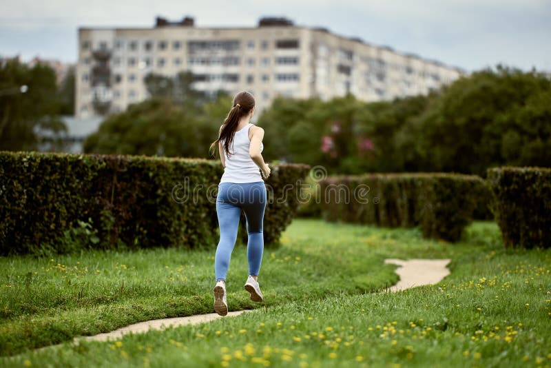 Rear View of Woman Runner in City Park. Stock Photo - Image of sportive ...