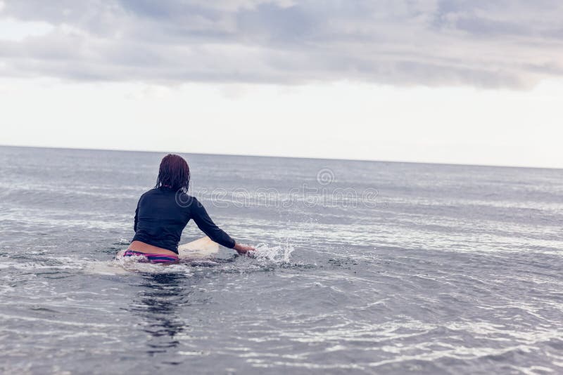 Rear View of a Woman with Surfboard in Water Stock Image - Image of ...