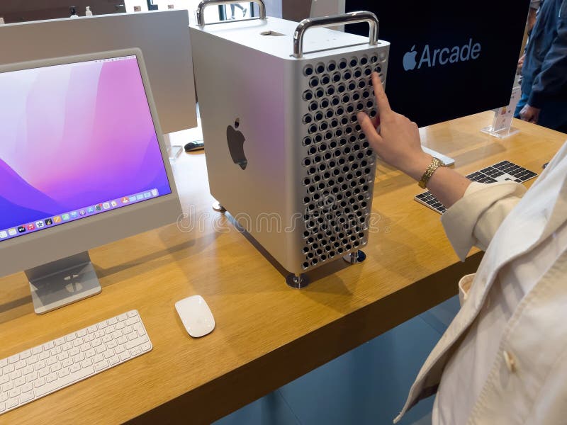 Rear View of Woman Touching the Ventilation Holes of the Mac Pro ...