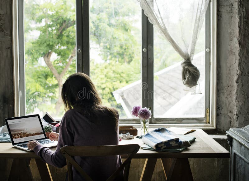 Rear View of Woman Working on Computer Laptop on Wooden Table Stock ...