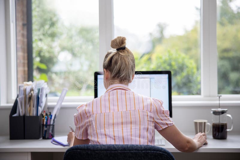 Rear View of Woman Working from Home on Computer in Home Office Stock ...