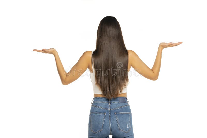 Rear View of a Young Beautiful Woman Holding Imaginary Objects in Her ...