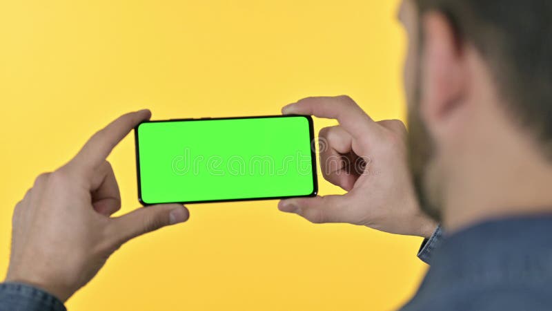 The Rear View of Young Designer Holding Smartphone with Chroma Screen ...