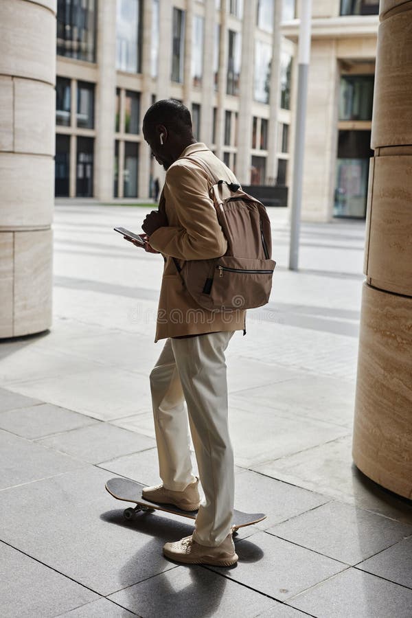 Rear View of Young Elegant Man with Backpack and Smartphone Stock Photo ...