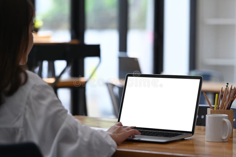 Young Female Office Worker Working with Computer Laptop at Modern ...