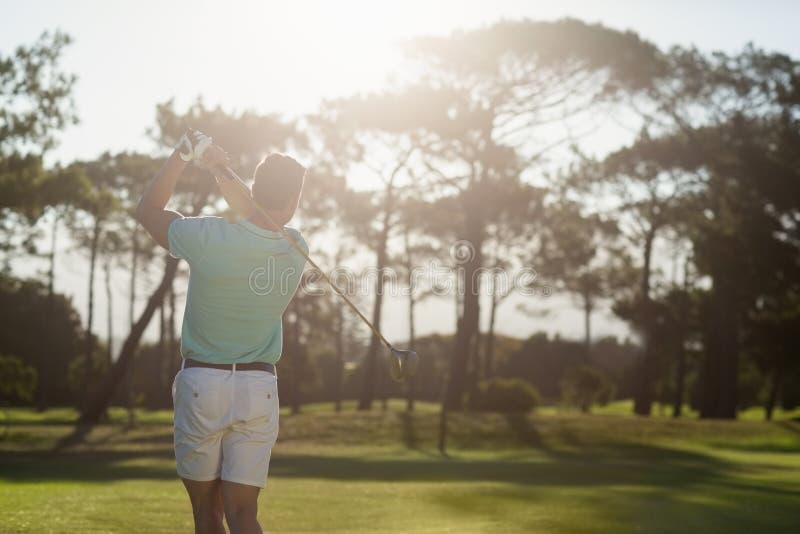 Rear View of Young Golfer Taking Shot Stock Photo - Image of club ...