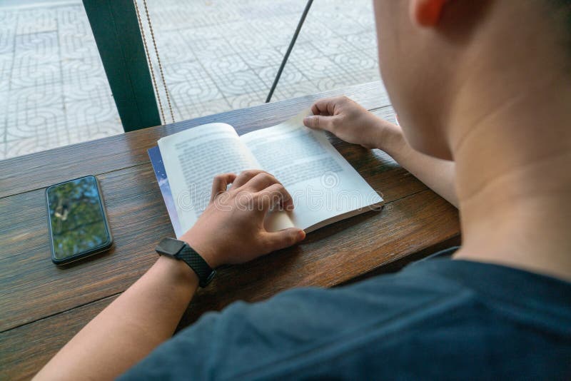Rear View of Young Man Read a Book Stock Image - Image of sitting ...